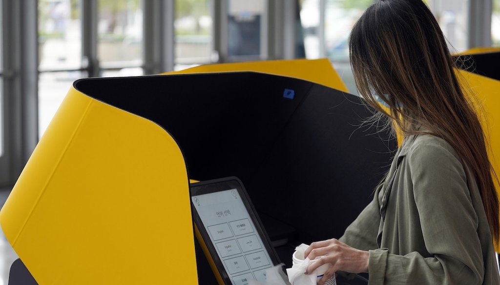 PolitiFact | A Facebook post told of an Illinois voter’s touch-screen ...